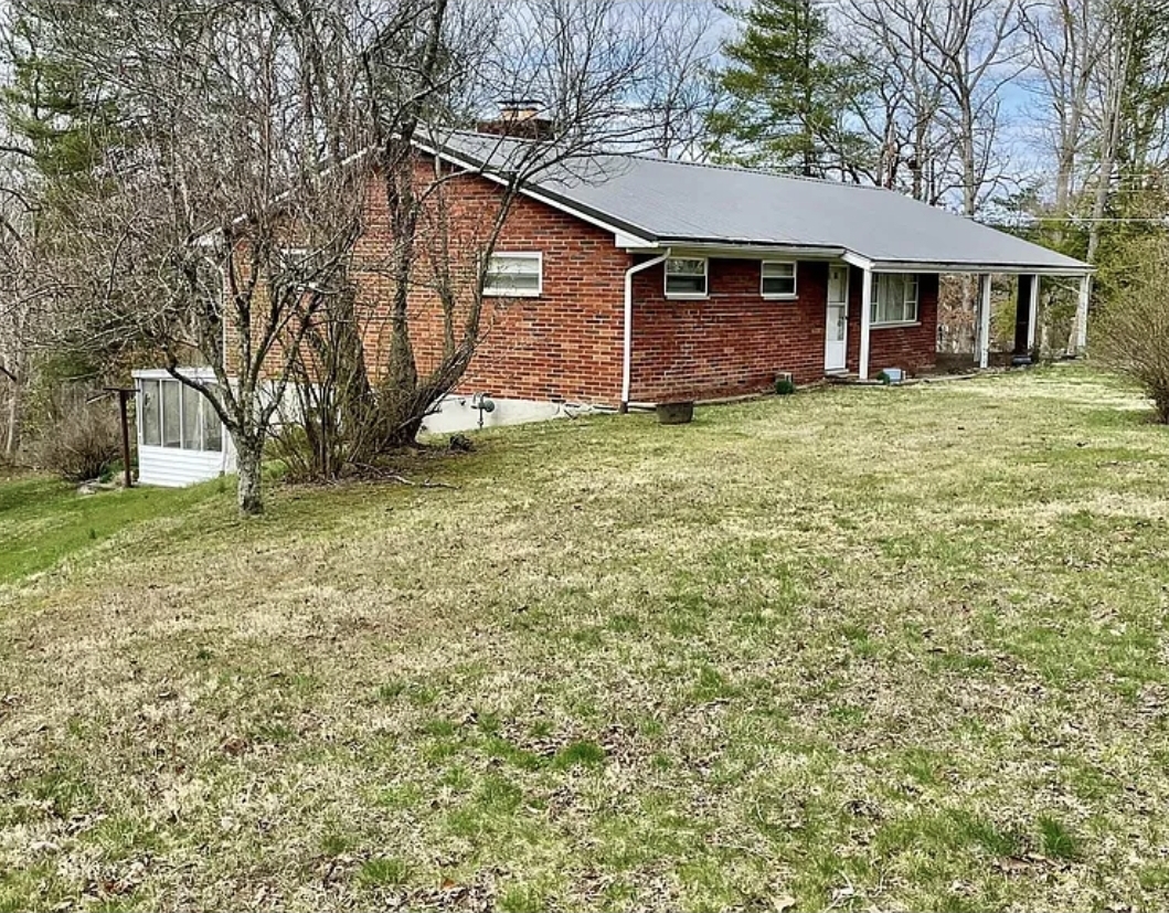 Spacious Brick Ranch Home with Multiple Living Areas and Wooded Privacy ...